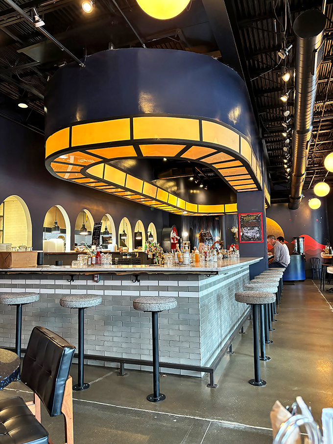 The illuminated counter bar glows like the control panel of a delicious spaceship, with stools awaiting hungry pilots ready for takeoff.