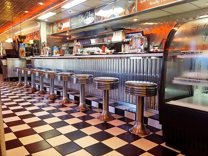 These chrome counter stools have supported generations of hungry patrons, each one perfectly positioned for optimal people-watching and plate-clearing.