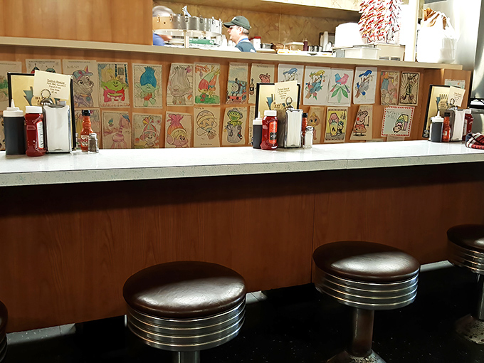 The counter seats&mdash;where solo diners become regulars and servers remember your order before you've even settled onto the chrome stool.