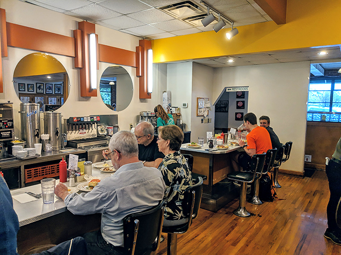Counter seating: where solo diners become part of the diner's rhythm, watching the short-order ballet while nursing endless coffee refills.