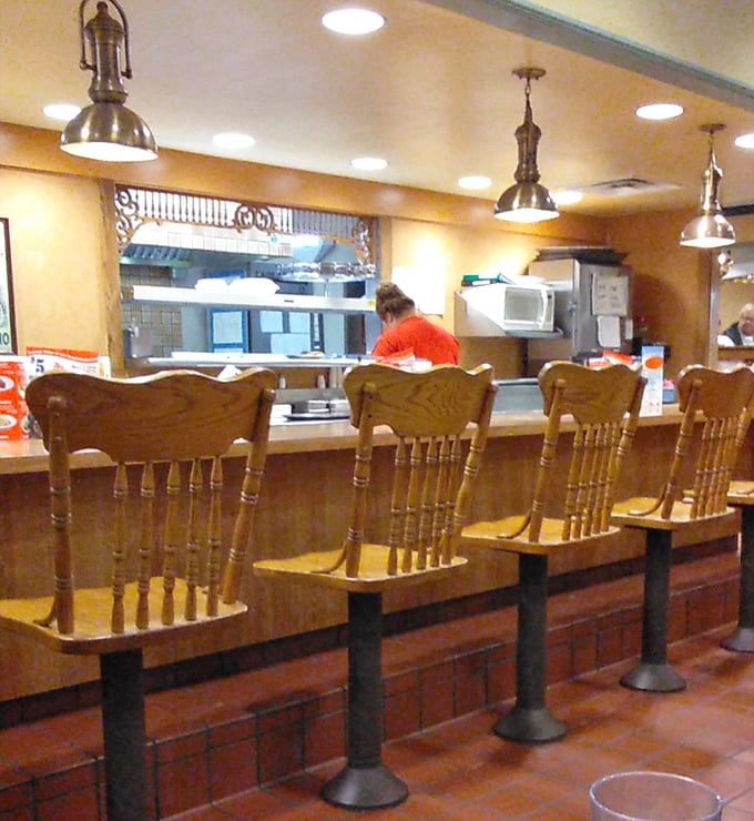 The counter seats&mdash;where solo diners become regulars and servers remember your order before you sit down. The kitchen view is dinner and a show, Ohio-style.