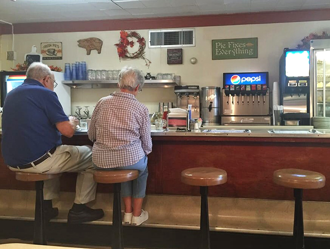 The breakfast counter where morning rituals unfold and the coffee flows as freely as local gossip.
