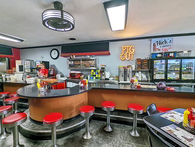 The counter with its classic red stools offers front-row seats to the culinary theater that is Nick's Kitchen.