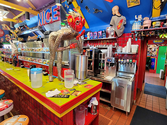 The counter area screams "NICE" in neon, while a leopard sculpture stands guard over the milkshake station. Subtlety is not on the menu.