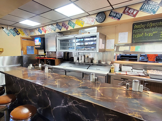 Counter seats offer front-row tickets to the breakfast theater happening behind the kitchen window.
