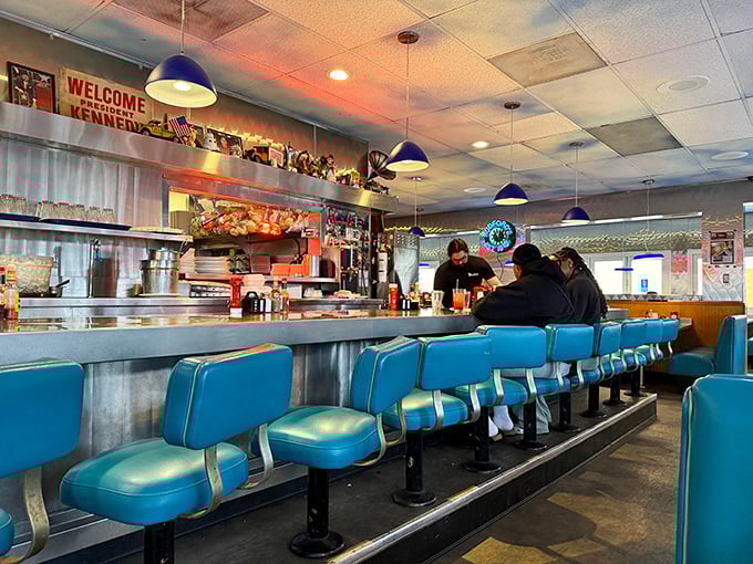 Blue counter stools await their next occupants like front-row seats to the greatest show on earth: breakfast being made with decades of experience.