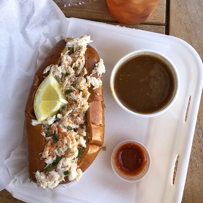 This crab roll with a side of bisque isn't just lunch&mdash;it's a coastal vacation on a tray, no sunscreen required.