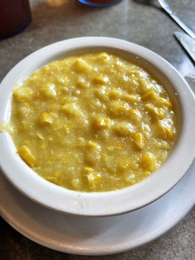 Creamed corn that looks like it was made by someone's grandmother who refuses to share the recipe but will happily serve you seconds.