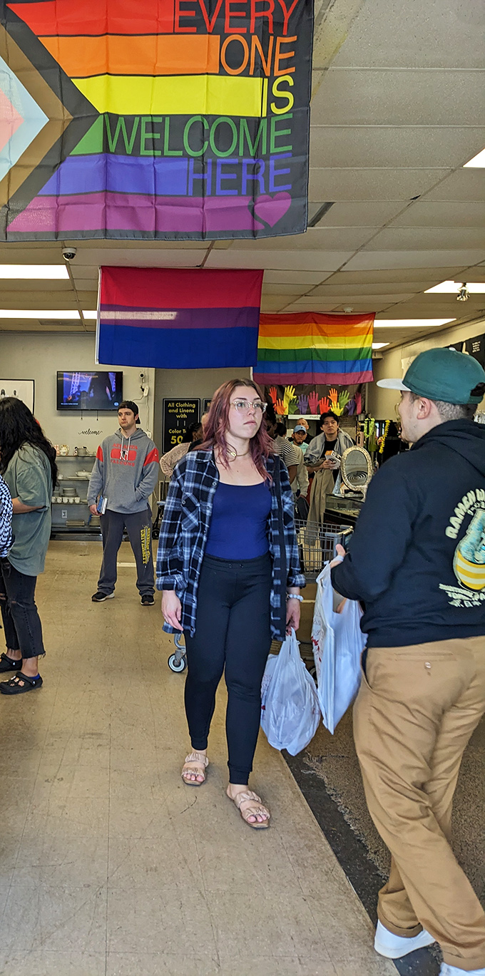 Rainbow flags declare "Everyone Is Welcome Here"&mdash;a shopping experience where both your budget and your authentic self can breathe easy.
