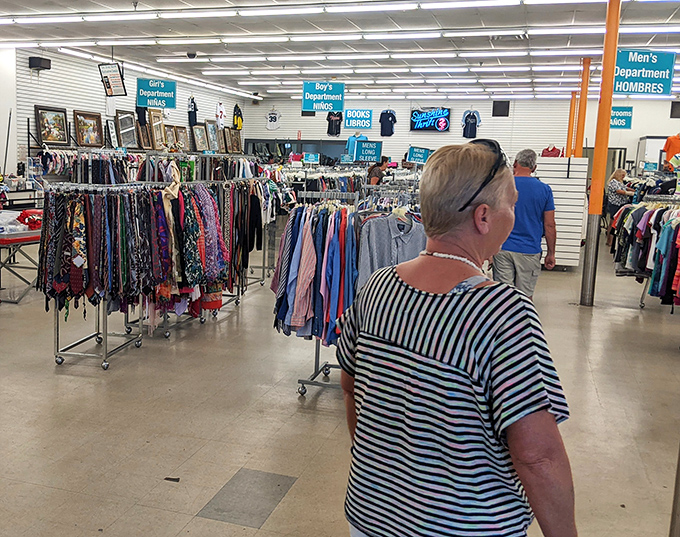 The clothing department&mdash;where snowbirds and locals alike hunt for Florida-appropriate fashion. Blue signs guide shoppers through this fabric forest.