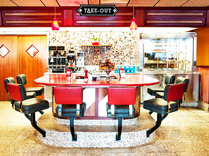 The counter island&mdash;diner royalty's throne room. Red vinyl and chrome create the perfect perch for solo diners and breakfast philosophers alike.