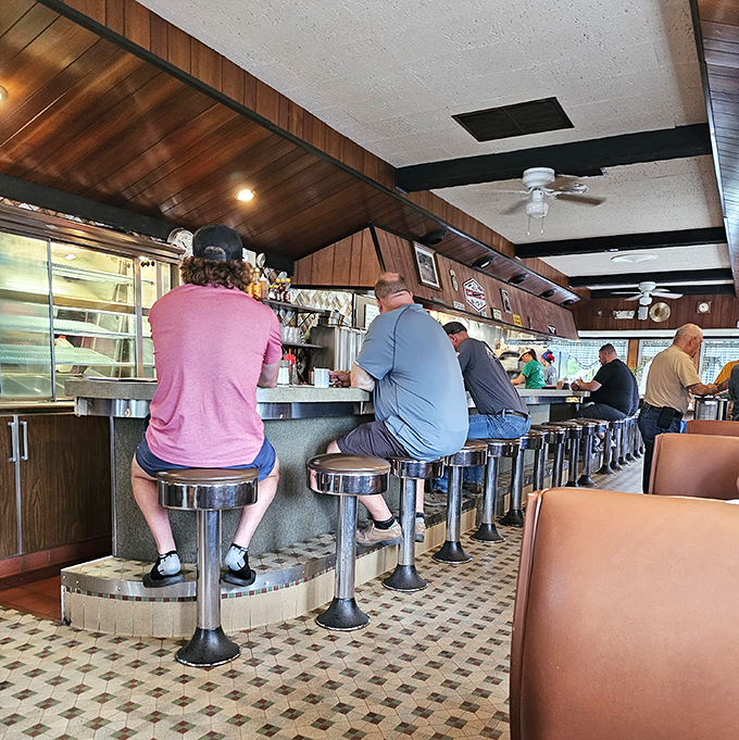 The counter crew&mdash;a morning ritual where strangers become neighbors over coffee refills and shared newspaper sections.