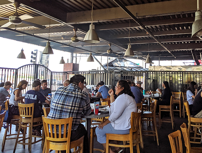 Happy diners fill every corner, creating that unmistakable buzz of a place that's clearly doing something very right.