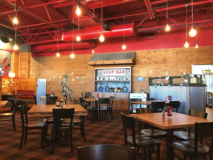 Red ceiling pipes exposed like arteries feeding life into this dining room. Simple tables that let the food be the real showstopper.