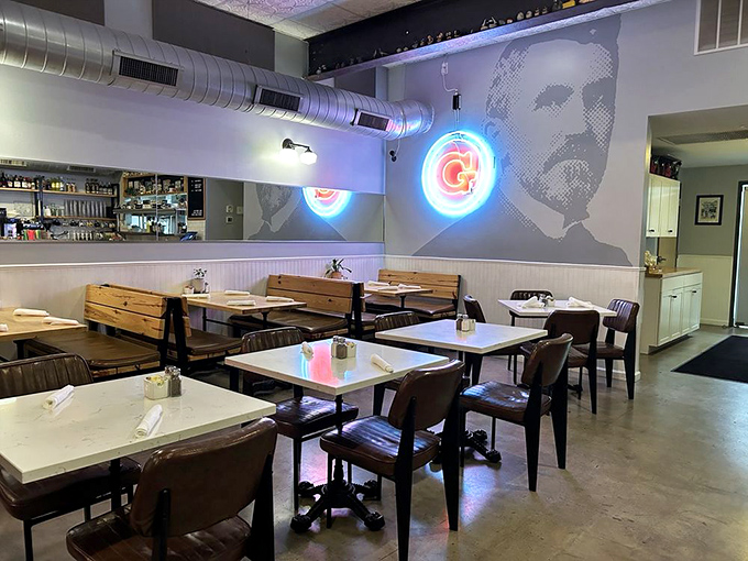 The dining area's industrial touches and neon accents create a space that feels both contemporary and comfortably familiar.