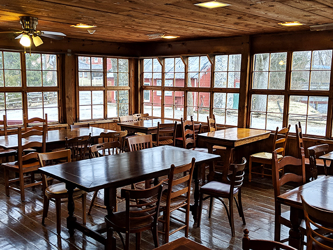 Sunlight streams through windows framing the mill's history, while tables patiently wait for the next round of pancake enthusiasts.