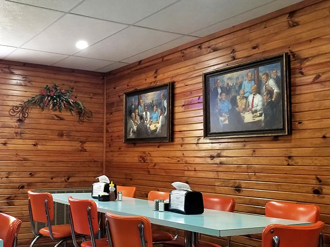 Mint-green tables paired with bright orange chairs create a retro vibe that feels like a warm hug from your favorite decade.