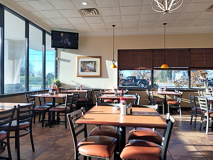 A dining room bathed in natural light where you can catch the game while catching up&mdash;the modern diner's perfect balance of comfort and connection.