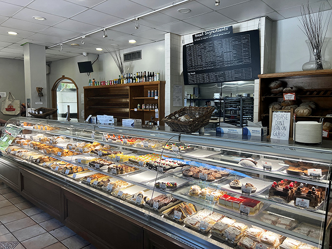 This display case isn't just refrigerated—it's a museum of edible art. Each pastry and cake sits like a masterpiece waiting for its forever home.