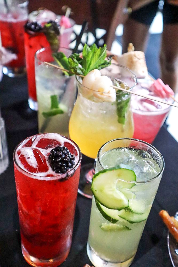 Cocktails that look like they belong in a modern art museum but taste like vacation in a glass.