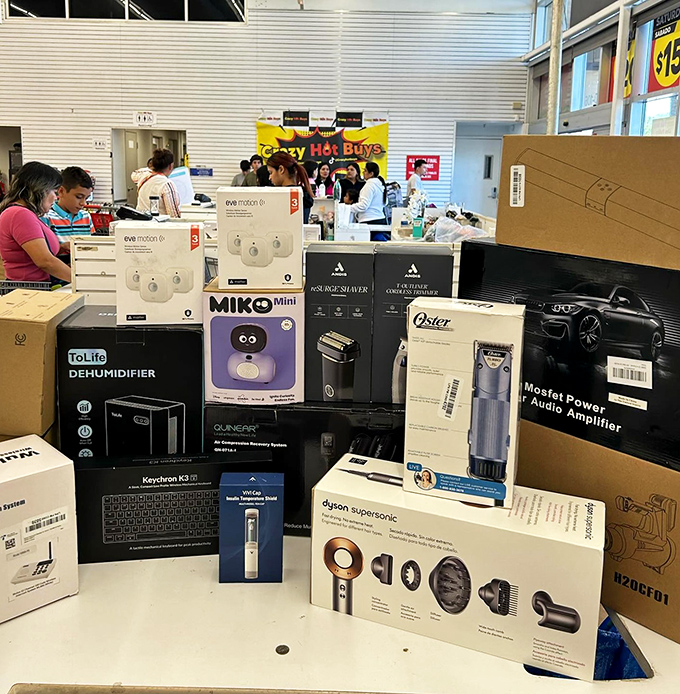 The electronics section resembles a tech convention where everything's on clearance. Dyson, Oster, and friends waiting for adoption at rescue-shelter prices.