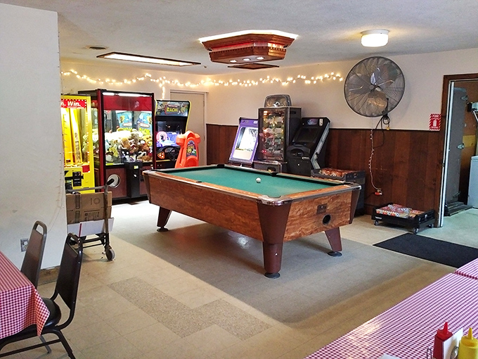 The game room proves that Capricorn Inn understands a fundamental truth: good food tastes even better after a competitive round of pool.