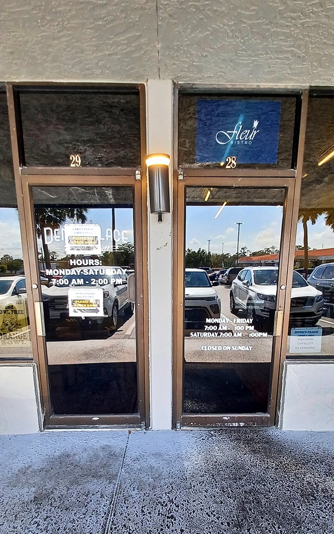 Hours posted on glass doors reflect Florida sunshine, promising breakfast and lunch Monday through Saturday for hungry Lakeland residents.
