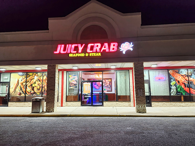 By night, the Juicy Crab sign glows like a lighthouse guiding hungry sailors. The promise of seafood salvation just beyond those doors.