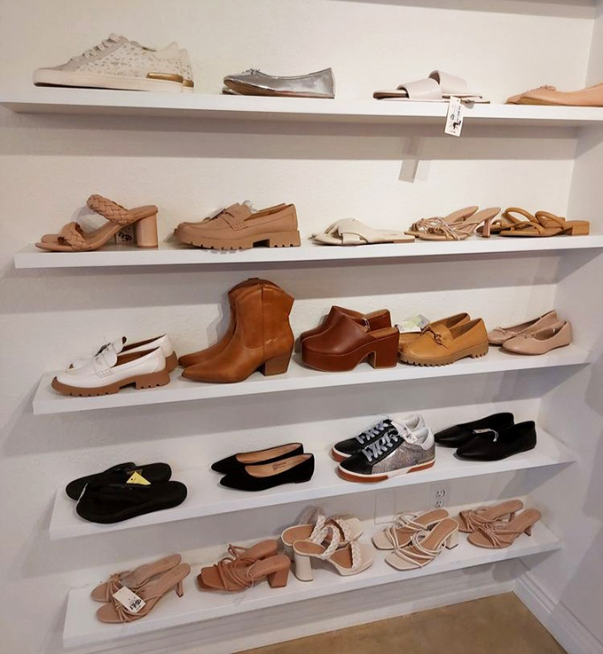 The shoe wall: where footwear fantasies come true at prices that won't give your credit card nightmares. Those cognac boots are calling my name!