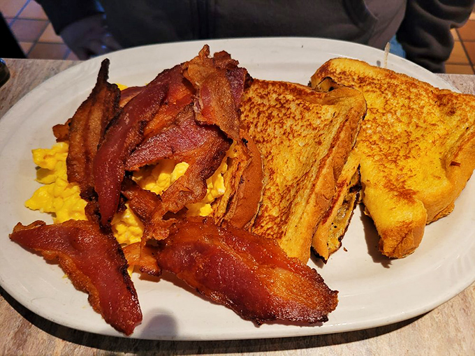 French toast and bacon living their best lives together. This breakfast platter has solved more morning grumpiness than coffee and aspirin combined.