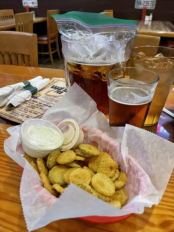 Fried pickles and cold beer—a combination so perfect it should have its own national holiday. The ultimate bar snack for serious conversations.