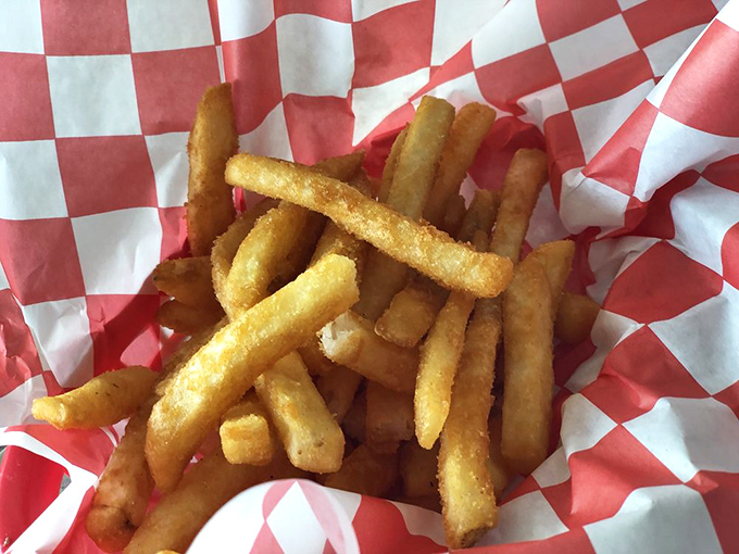 Golden fries served in a checkered basket&mdash;the universal language of satisfaction. Crispy on the outside, fluffy inside, and impossible to stop eating.