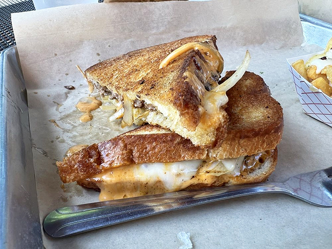 The Patty Melt: where grilled cheese meets burger in a beautiful union that would make any comfort food enthusiast weep with joy.