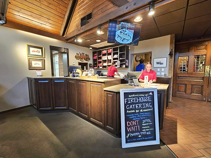 The rustic bar area isn't just functional; it's where barbecue dreams are coordinated and sent out to eagerly waiting diners.