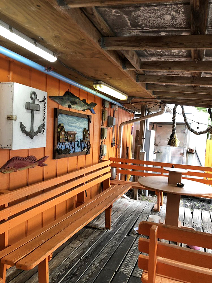 Nautical d&eacute;cor that wasn't purchased from a catalog but accumulated through decades of authentic coastal living. That anchor isn't ironic &ndash; it's earned.