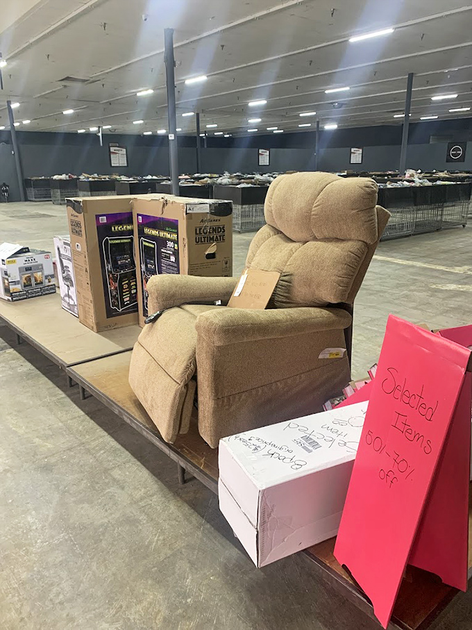 That recliner isn't just furniture&mdash;it's a throne awaiting its bargain-hunting royalty, complete with arcade cabinet courtiers.
