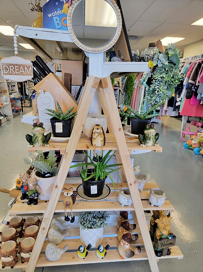 This wooden ladder display transforms ordinary garden figurines into an extraordinary collection. Those frogs aren't just decorative—they're judging your restraint as you reach for your wallet.