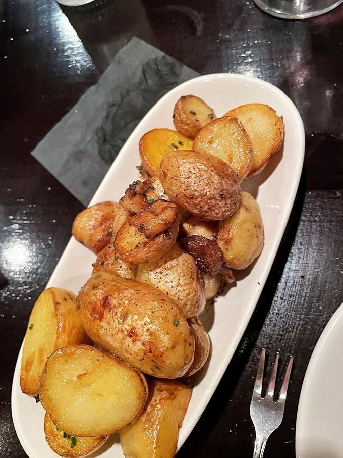 These roasted potatoes aren't just side dishes; they're little golden nuggets of comfort that could easily become your meal's main event.
