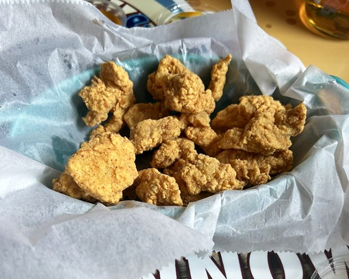 Golden-fried nuggets of goodness that disappear faster than you can say "pass the dipping sauce." Addictive little flavor bombs.