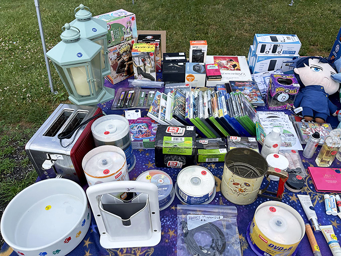 The table of random necessities you didn't know you needed. From lanterns to DVDs, it's like someone emptied a junk drawer the size of Texas.