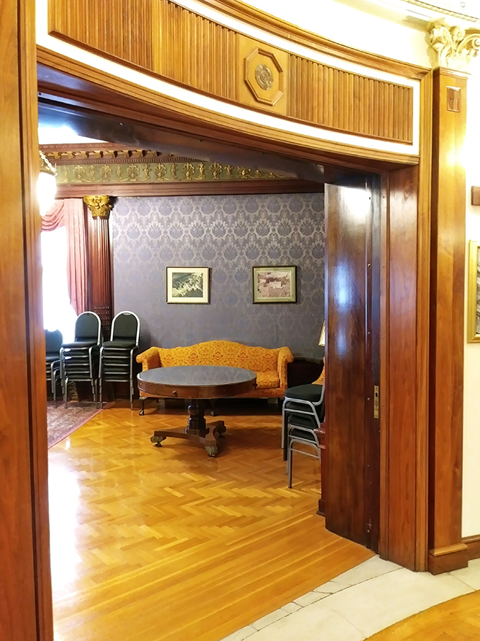 Peek through this ornate wooden archway into a room where the past century's most important conversations might have happened.