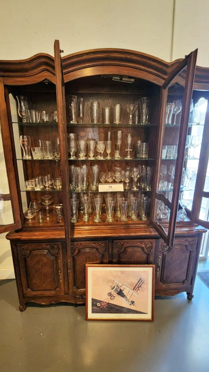 This ornate cabinet showcasing crystal stemware proves that yesterday's elegance is perfectly at home in today's celebrations.