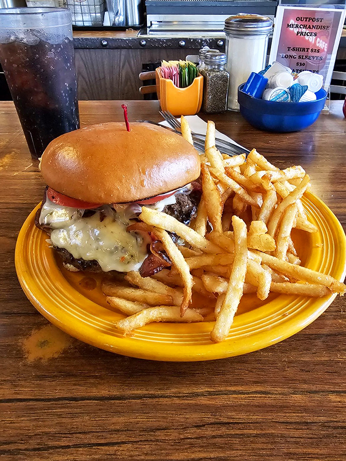 A burger that demands both hands and a strategy—melty cheese cascading down the sides like a delicious waterfall of indulgence.