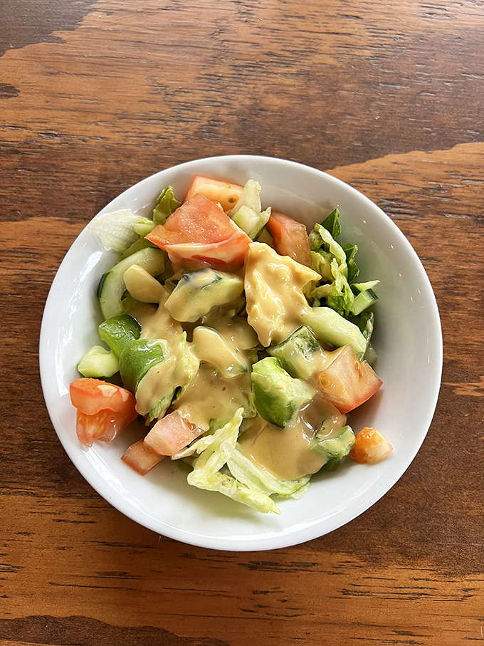 This house salad proves Germans understand vegetables too&mdash;crisp, fresh, and swimming just enough dressing to make cucumber and tomato feel special.