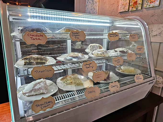 The dessert case &ndash; where willpower goes to die. Each handwritten pie label promises a different path to sweet surrender.