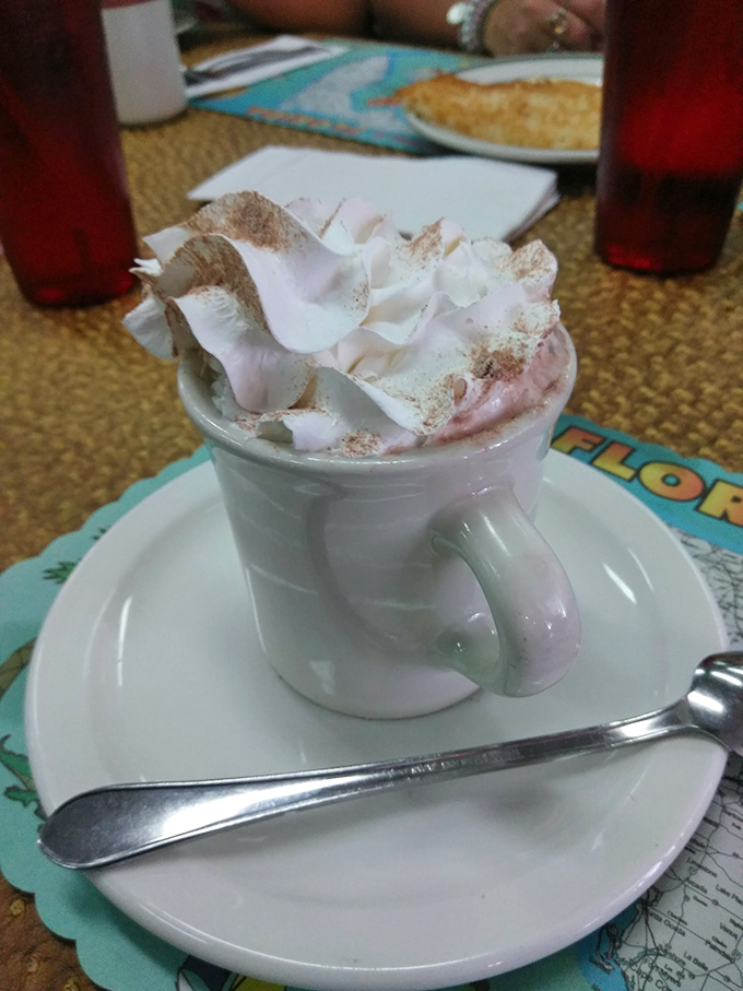 Hot chocolate that doesn't just arrive&mdash;it makes an entrance with a whipped cream hat and cinnamon freckles.