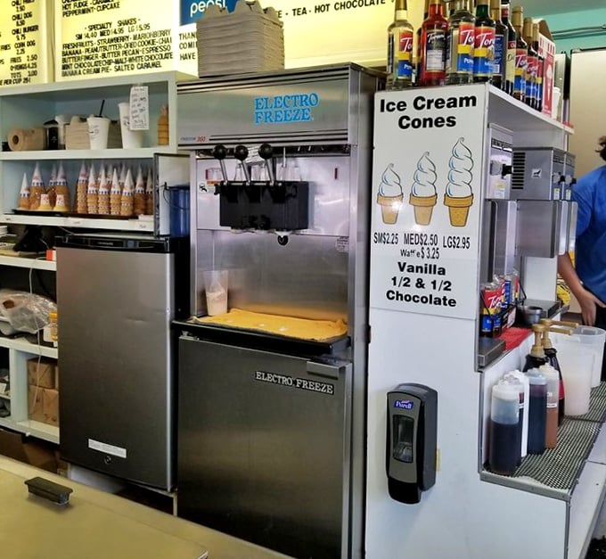 The soft-serve machine stands ready for duty, promising swirls of vanilla, chocolate, or the perfect twist &ndash; summer's ultimate accessory in cone form.