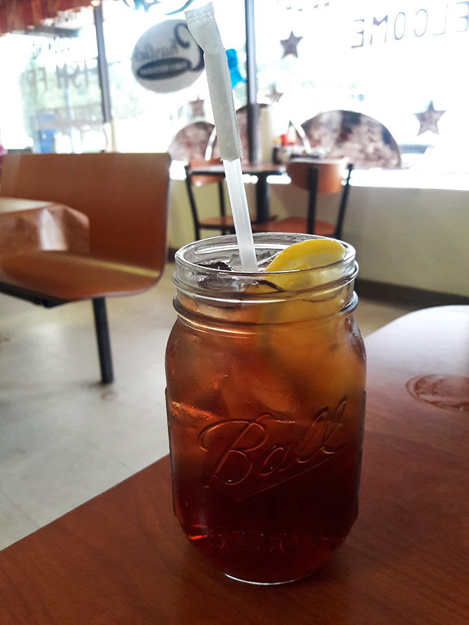 Sweet tea served in a Mason jar – because Florida knows some traditions are sacred. Refreshment doesn't need fancy glassware to hit the spot.