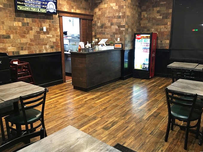 Clean lines, warm woods, and that welcoming counter invite you into a space where burger perfection is the only agenda item.