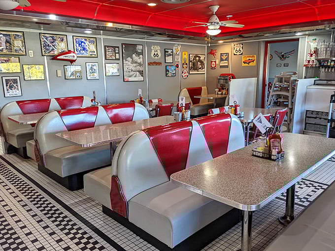 Red and white booths line the wall like candy canes, each one beckoning you to slide in and stay awhile.